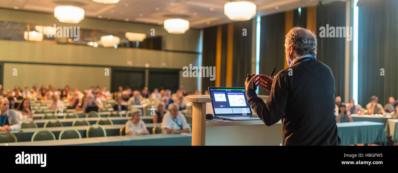 Senior public speaker giving talk at scientific conference Stock Photo ...