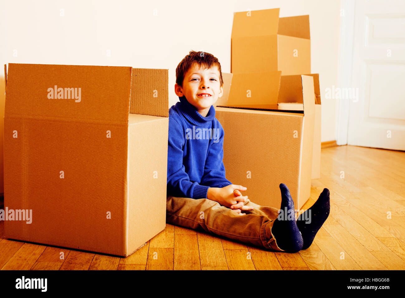 little cute boy in empty room, remoove to new house. home alone ...