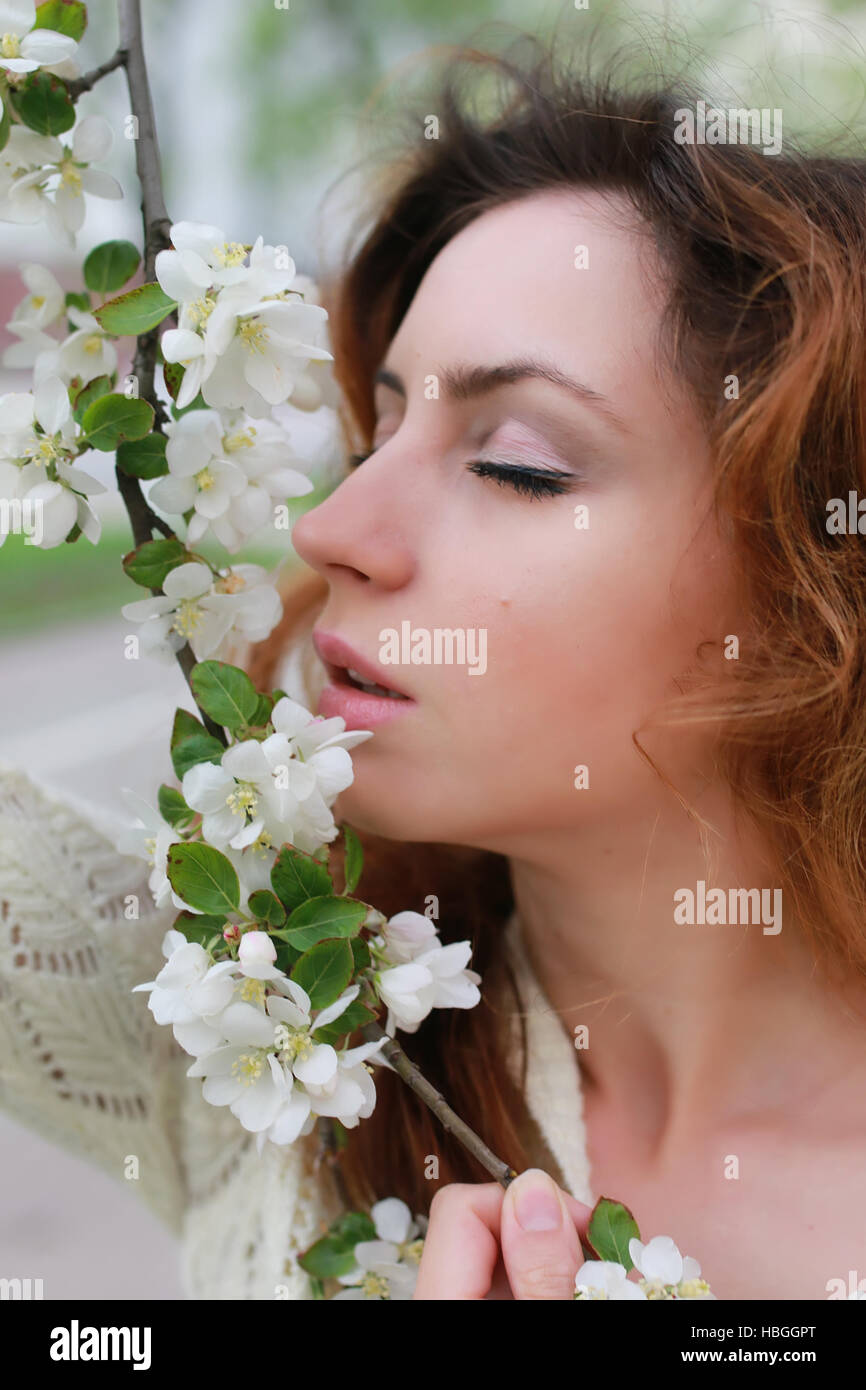 woman smell tree flower Stock Photo - Alamy