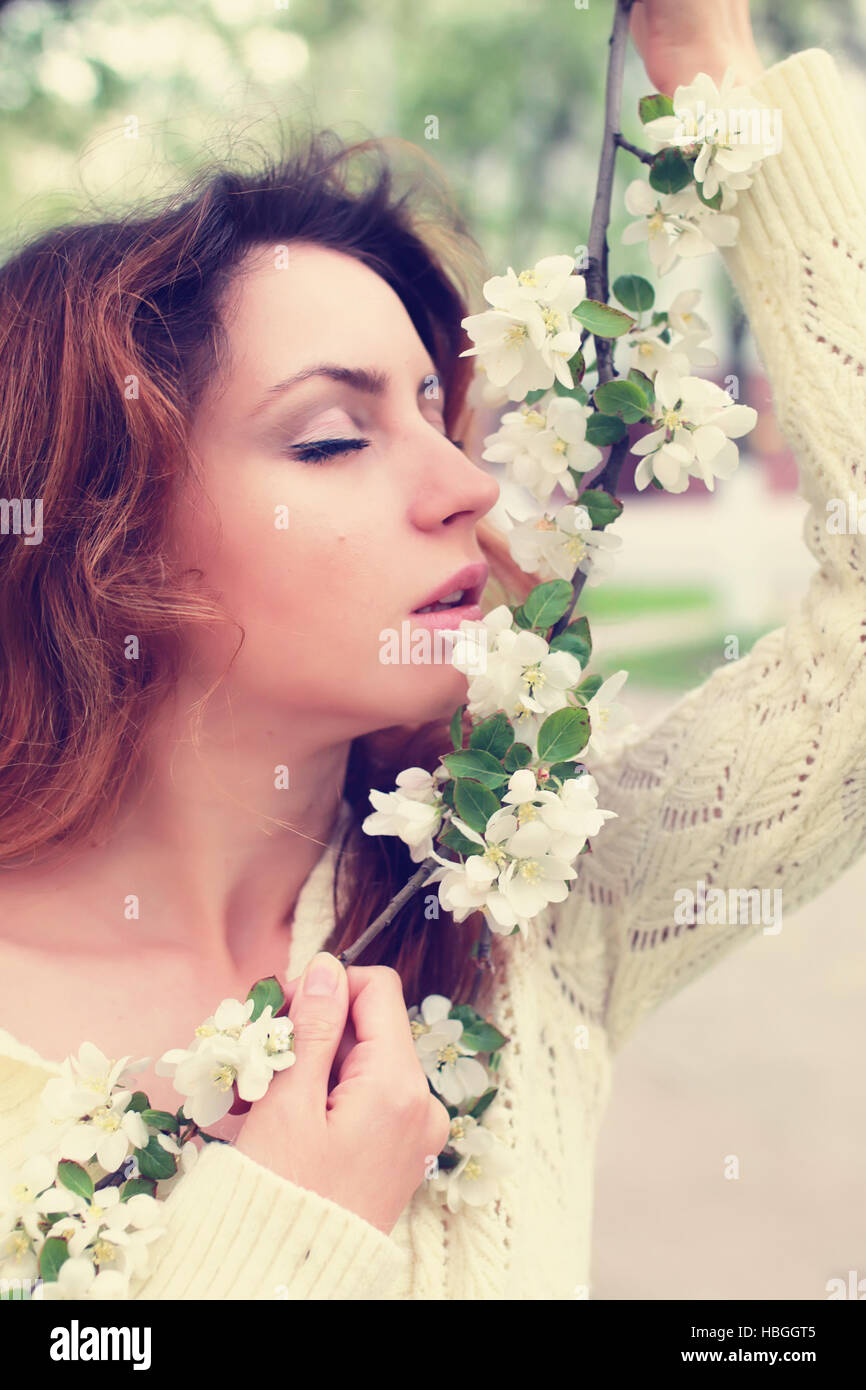 girl smell tree flower Stock Photo - Alamy