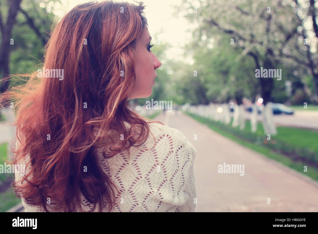 girl walking in spring apple alley Stock Photo - Alamy