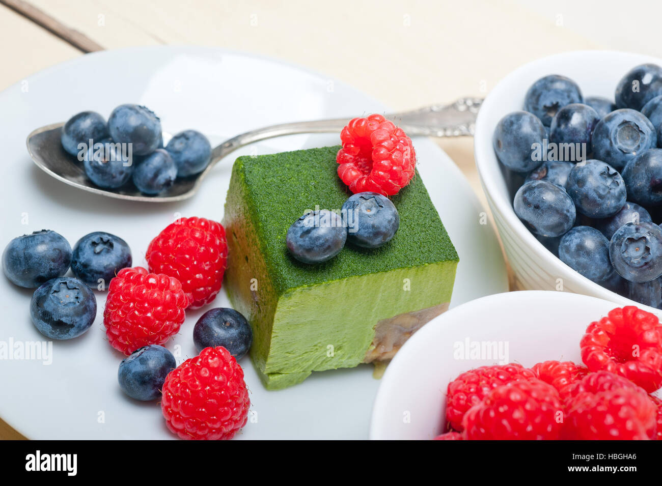 green tea matcha mousse cake with berries Stock Photo - Alamy