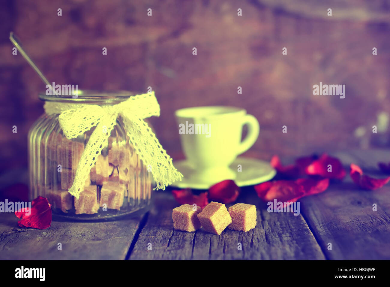 toned photo tea cup with sugar cubes Stock Photo - Alamy