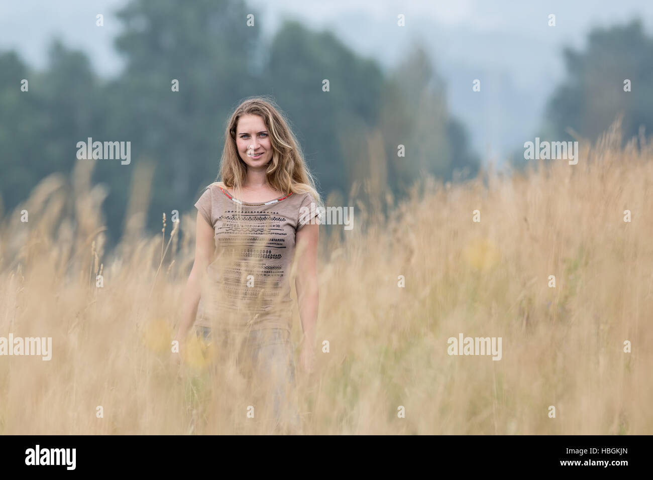 Girl in field Stock Photo - Alamy
