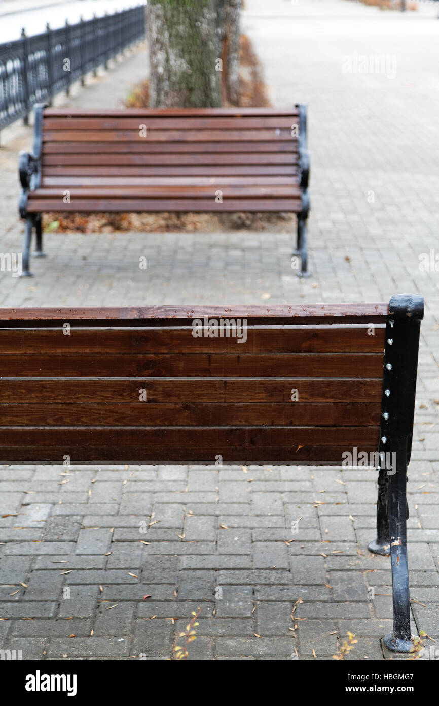 benches on a city street in autumn Stock Photo - Alamy