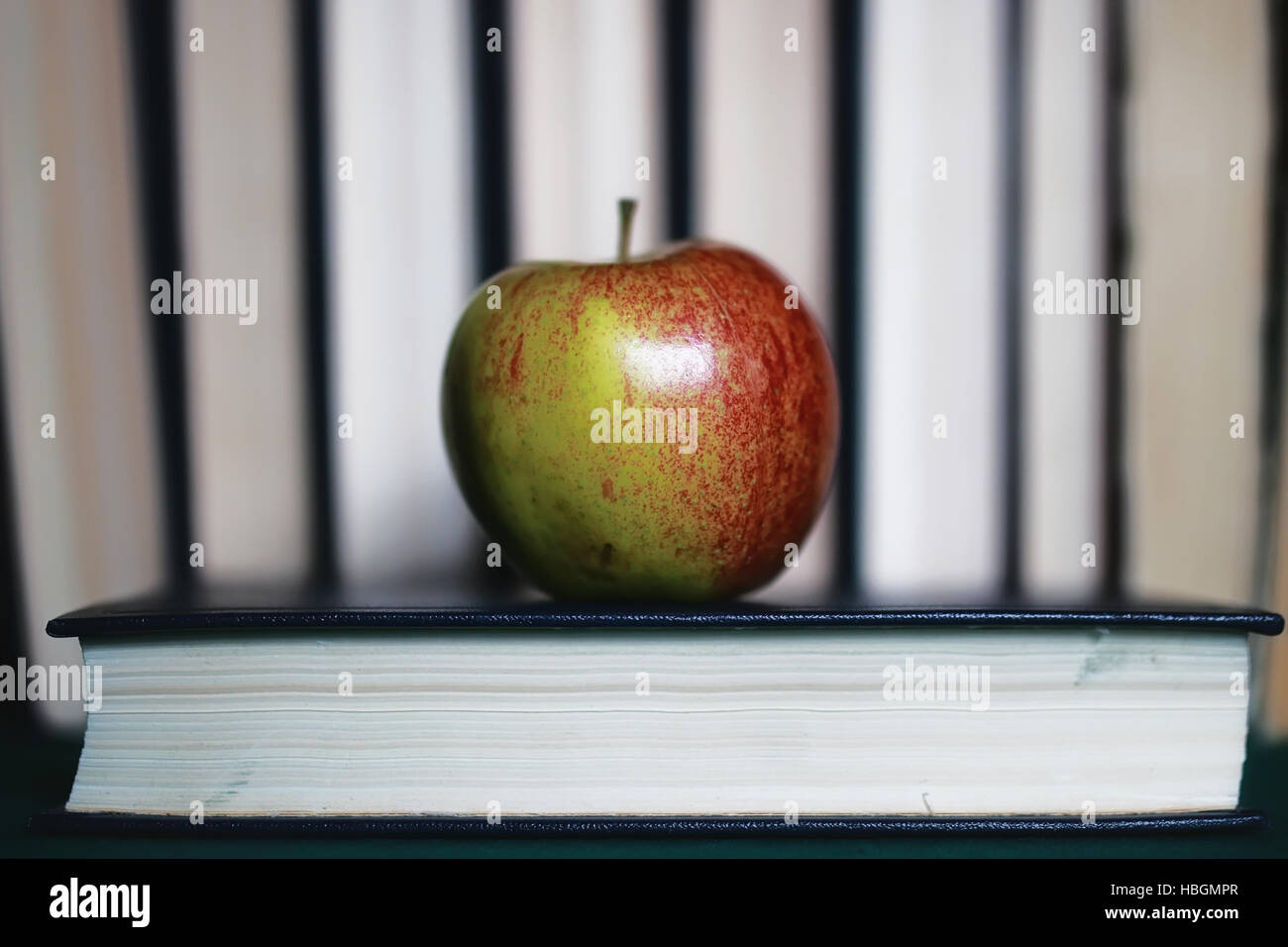 education concept books stack, apple and pen Stock Photo - Alamy