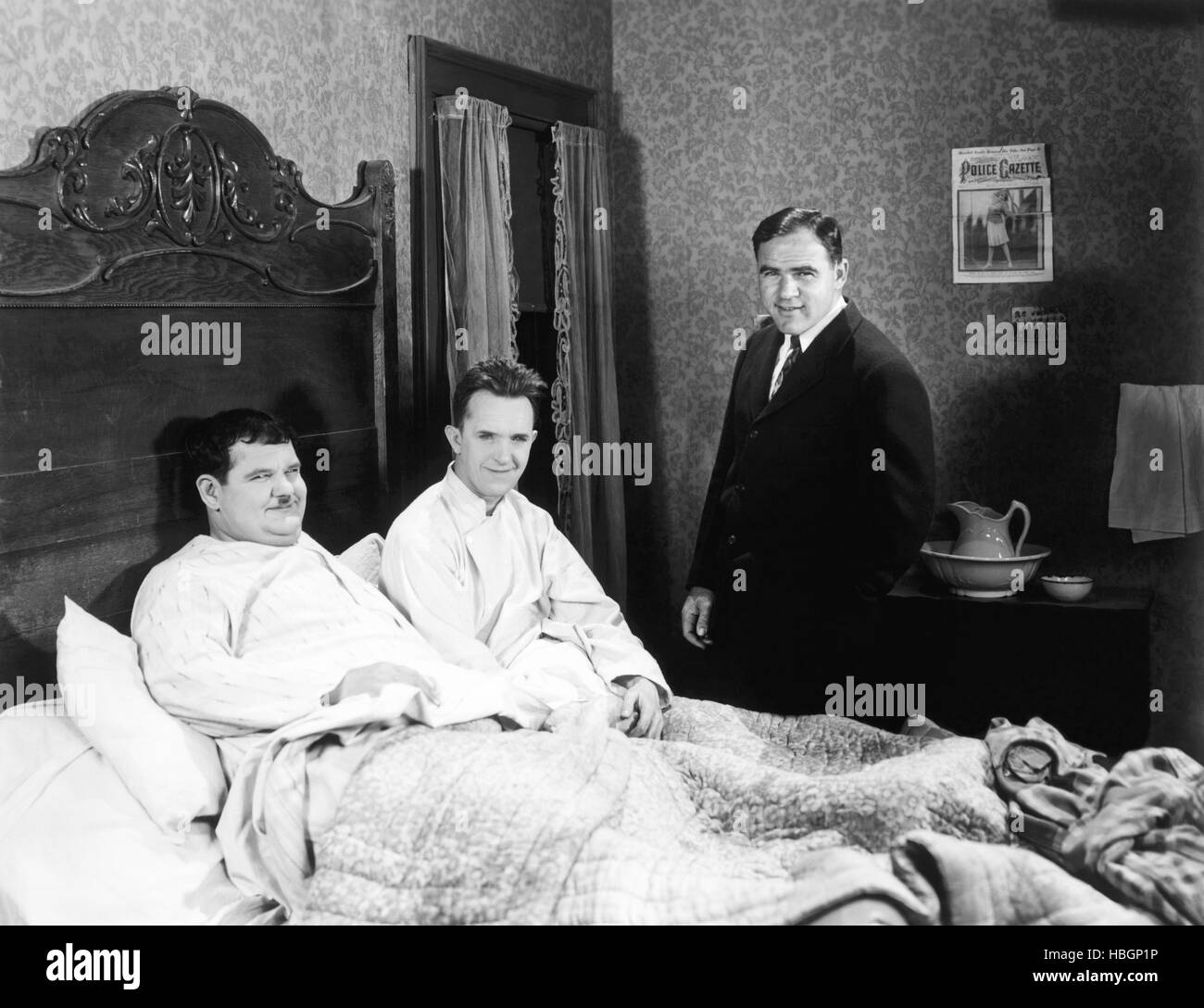 ANGORA LOVE, (from left): Oliver Hardy, Stan Laurel, producer Hal Roach ...