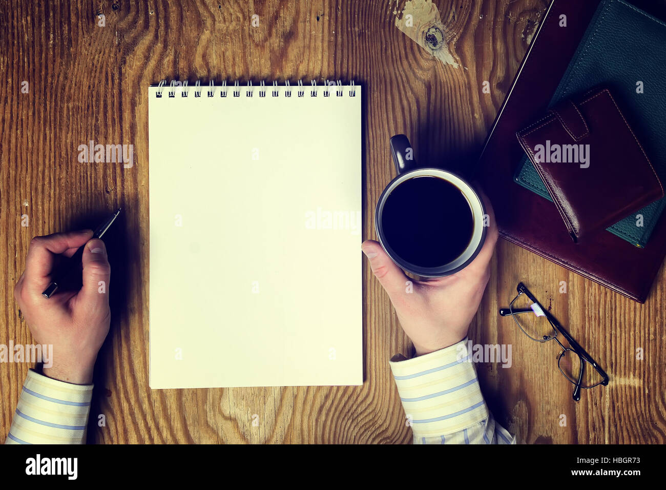 toned table write hand top view Stock Photo - Alamy