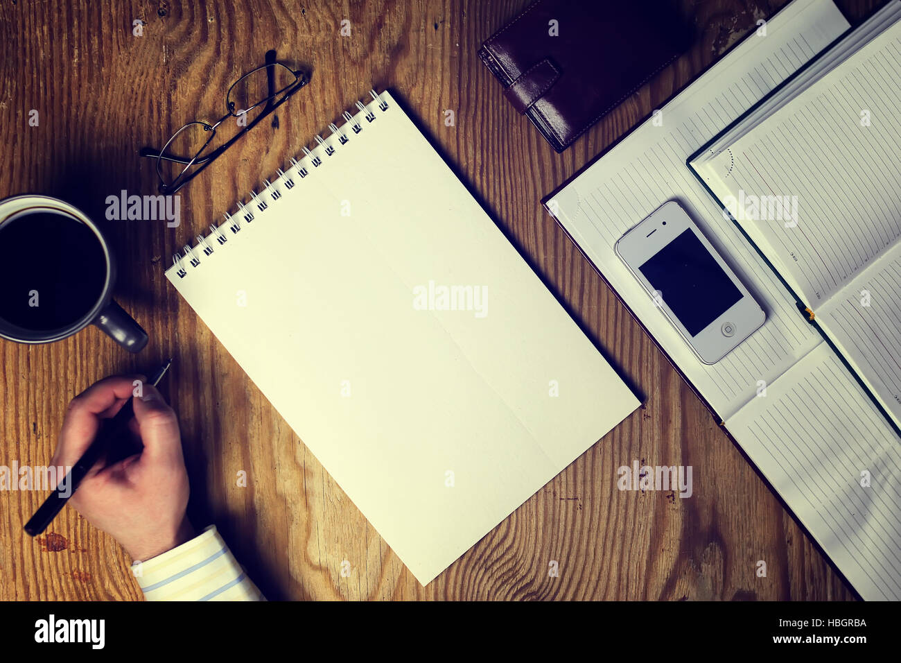 toned table write hand top view Stock Photo - Alamy