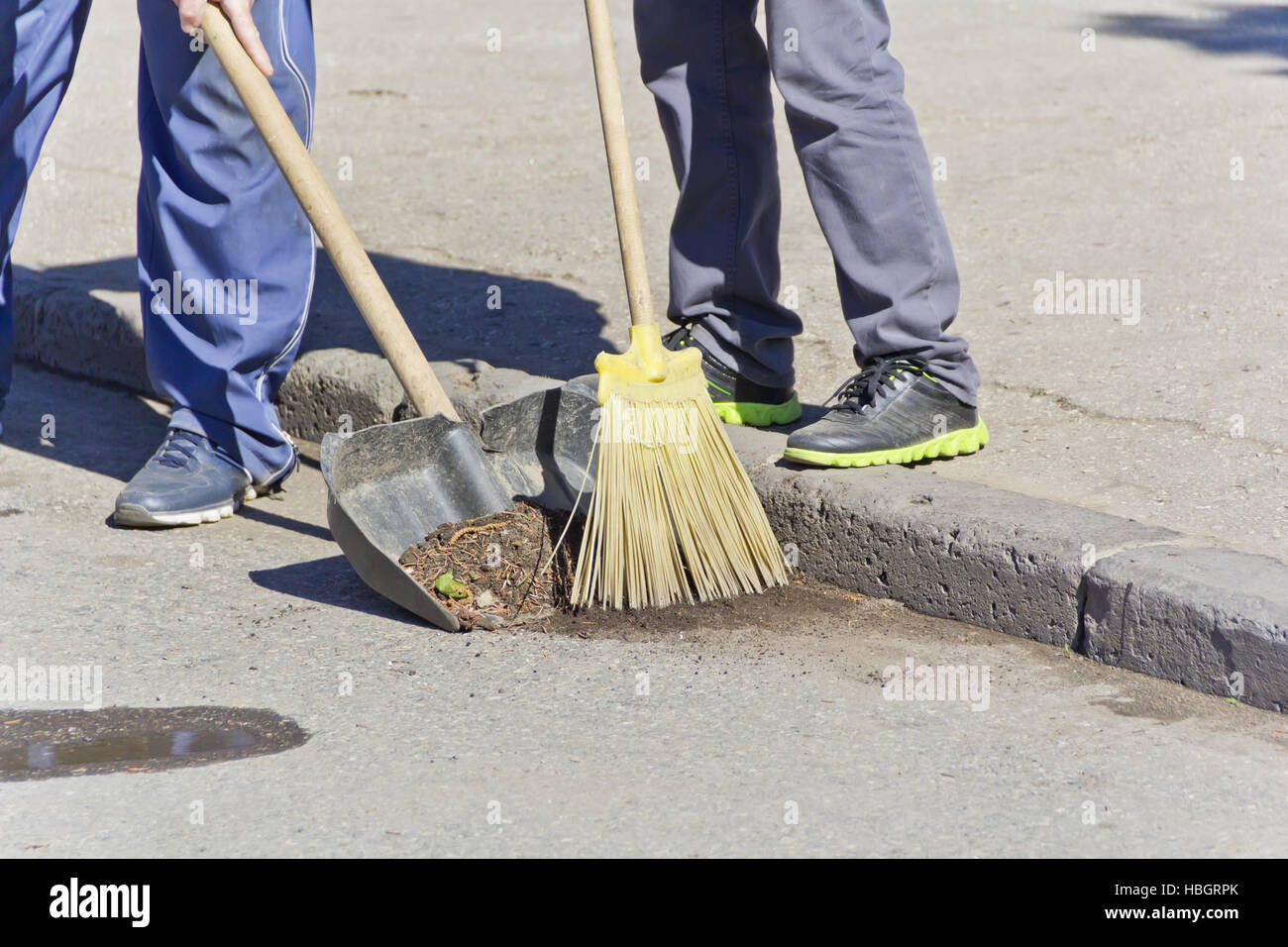Cleaning street with broom and shovel Stock Photo - Alamy