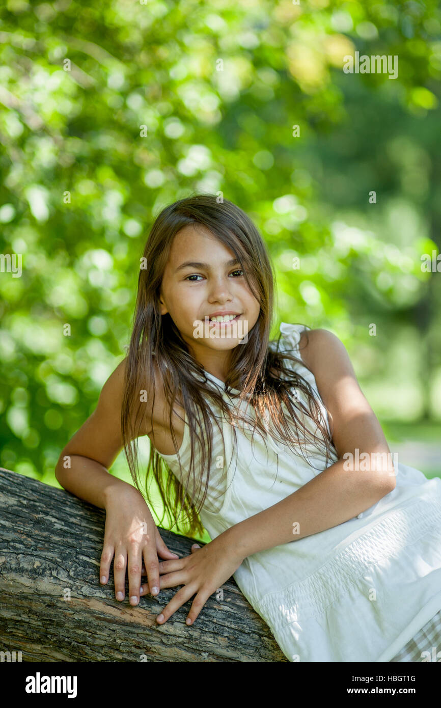 Girl lying on tree branch hi-res stock photography and images - Alamy