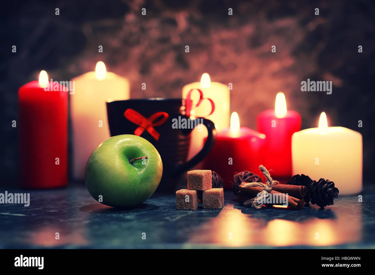 night table with mug and candle Stock Photo - Alamy
