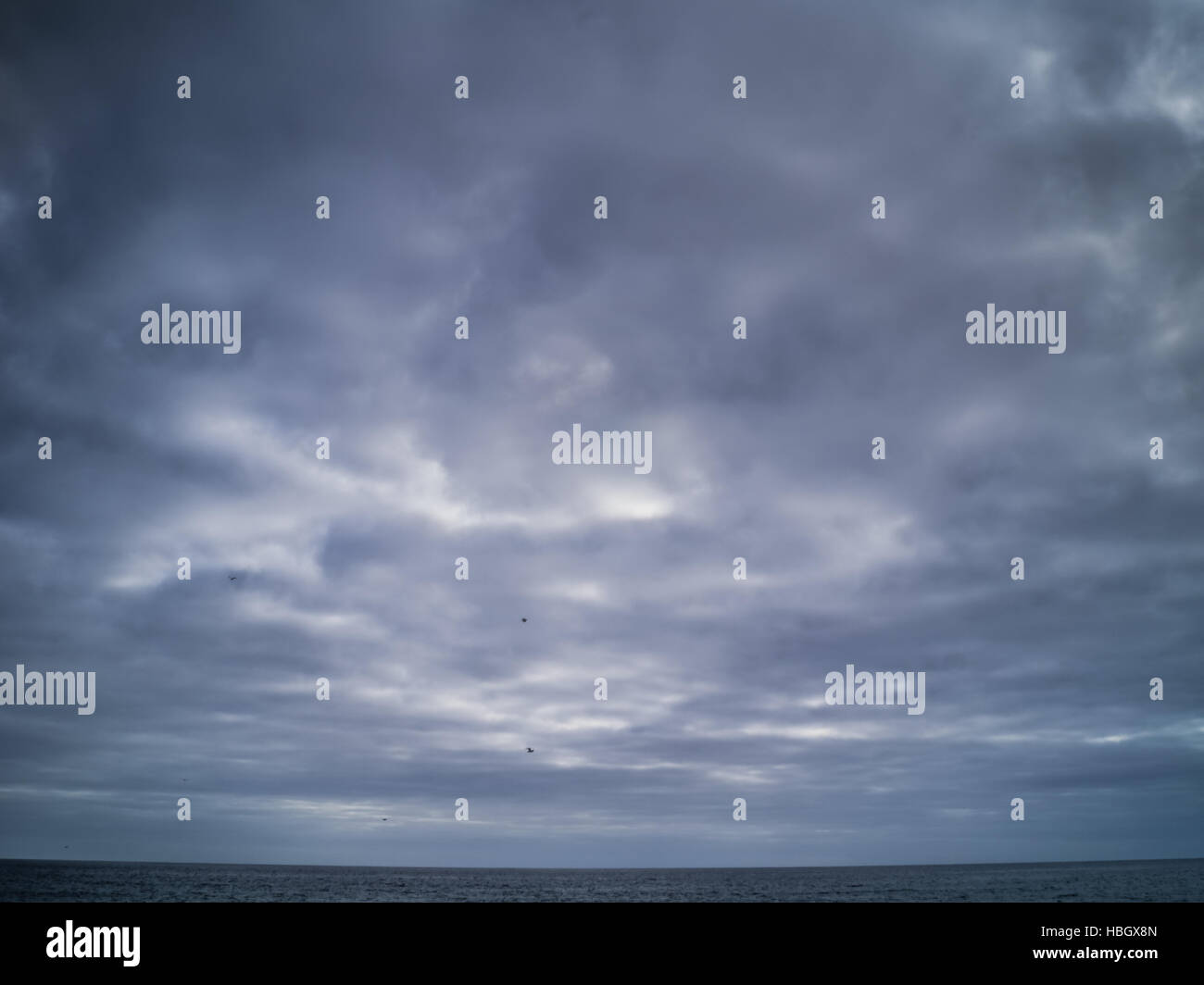 Dark clouds over the ocean hi-res stock photography and images - Alamy