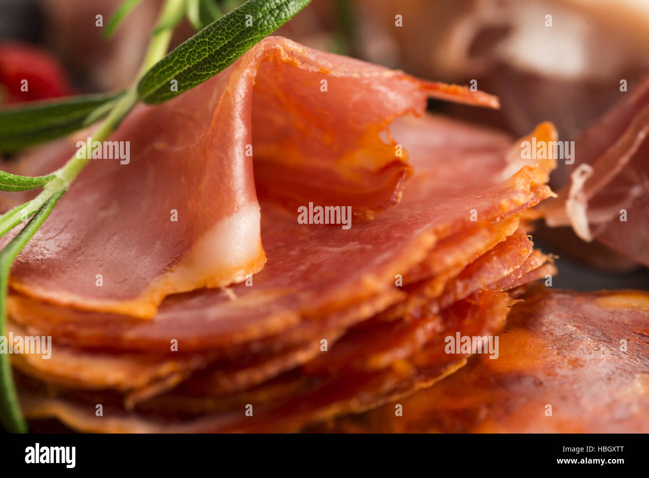 a pile of different spanish embutido, jamon, chorizo and lomo embuchado ...