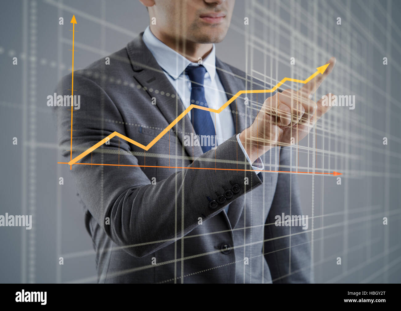 Young businessman with chart diagrams Stock Photo - Alamy