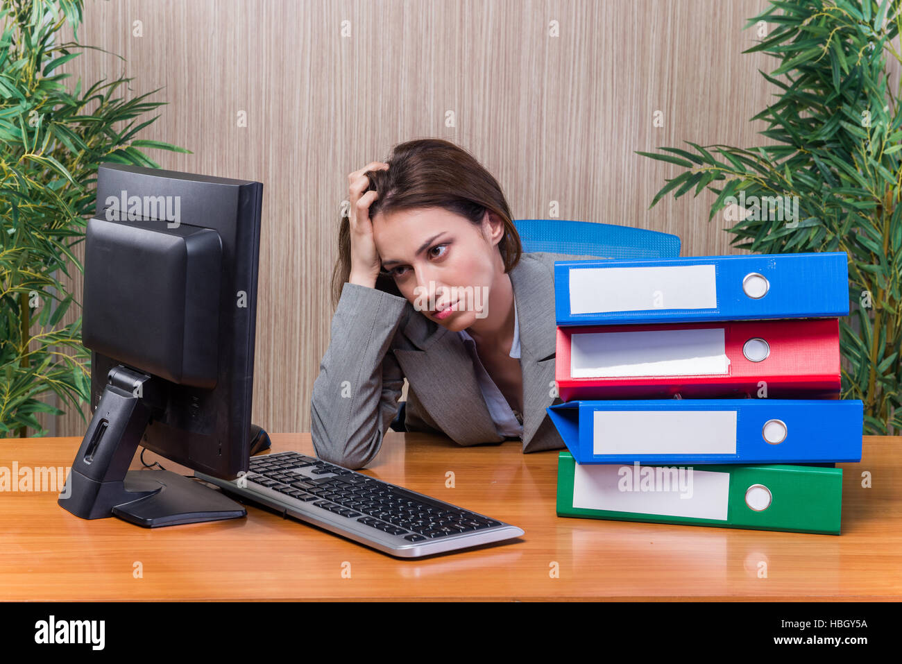 Tired woman stressed with too much work Stock Photo - Alamy