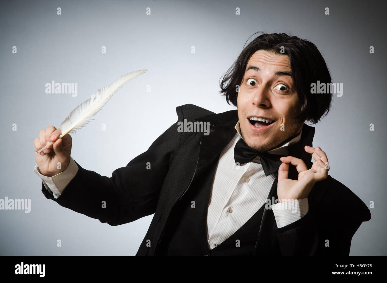 Funny writer with quill in vintage concept Stock Photo - Alamy