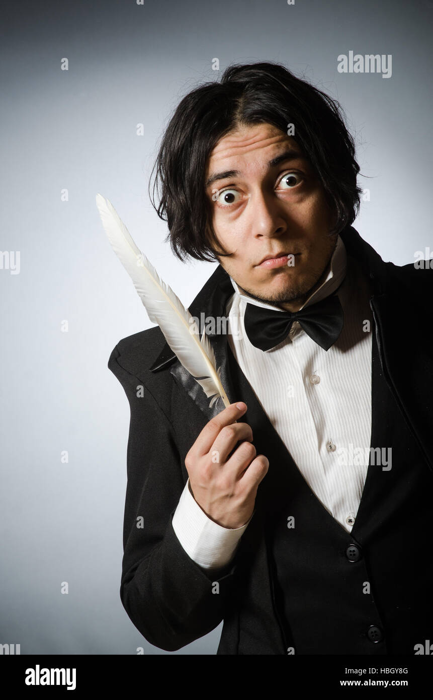 Funny writer with quill in vintage concept Stock Photo - Alamy
