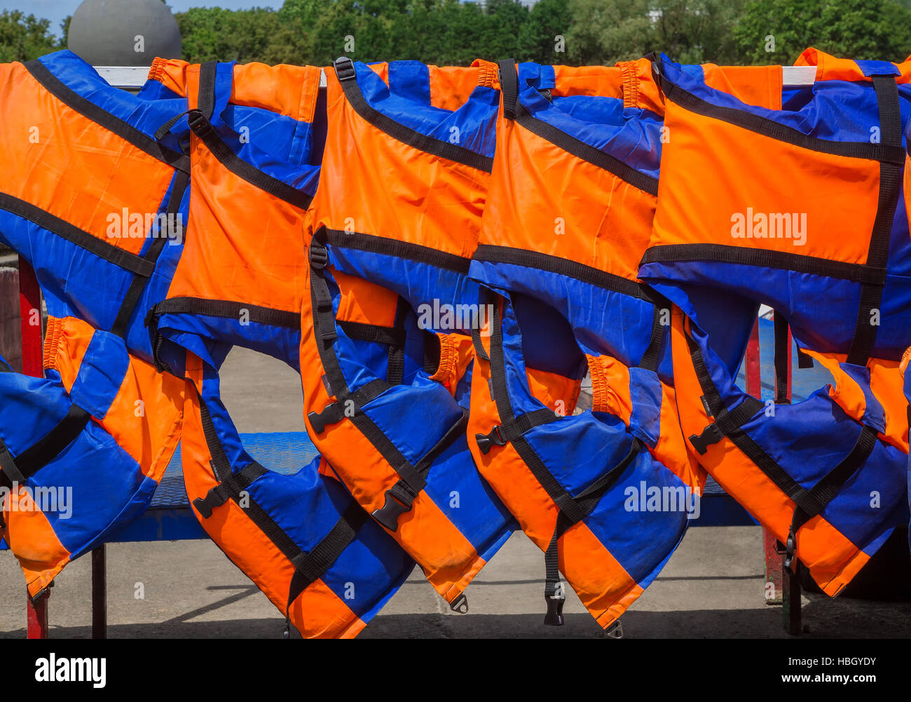 Orange life jackets Stock Photo - Alamy