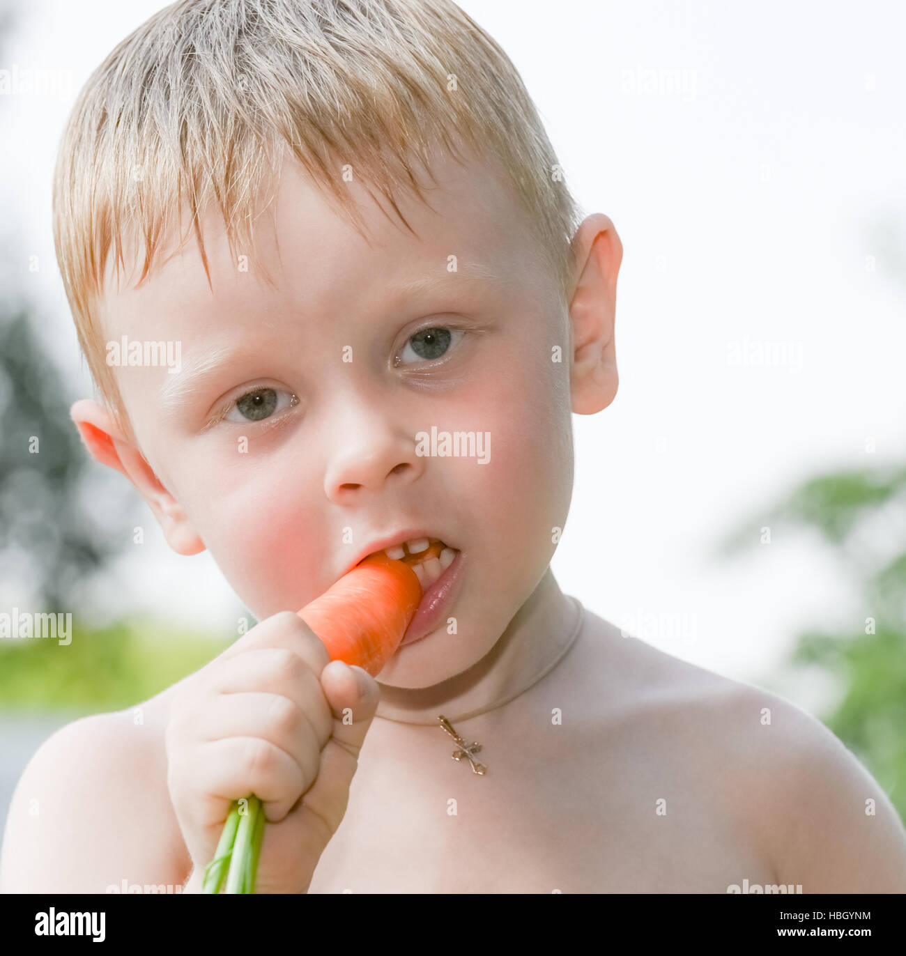 boy eating carrot Stock Photo - Alamy