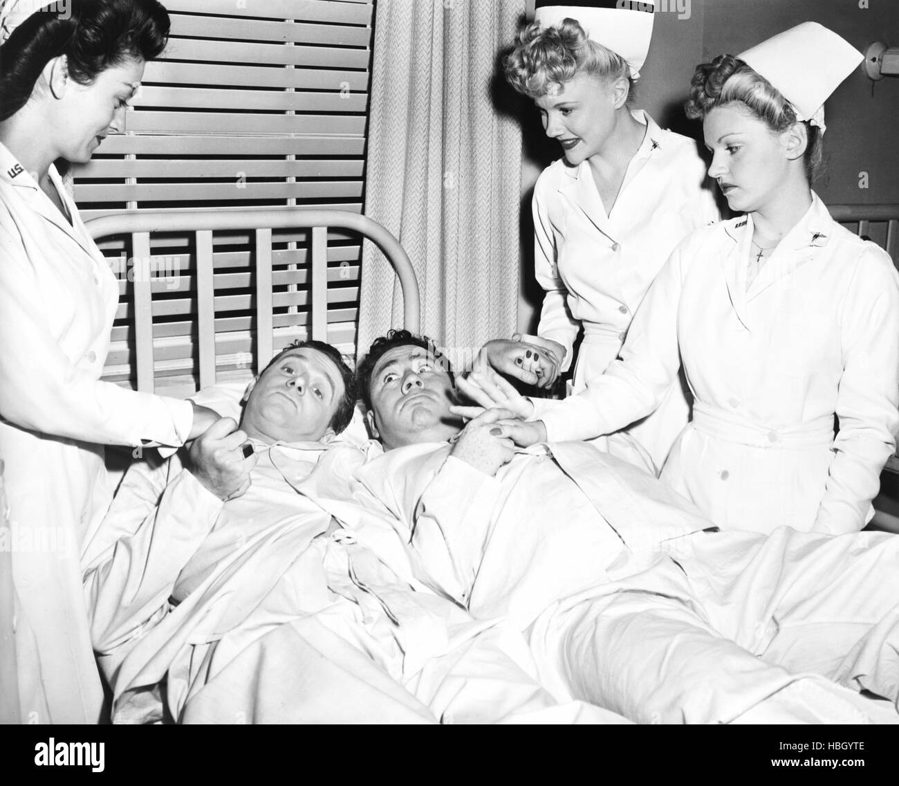 ADVENTURES OF A ROOKIE, in bed from left: Wally Brown, Alan Carney ...