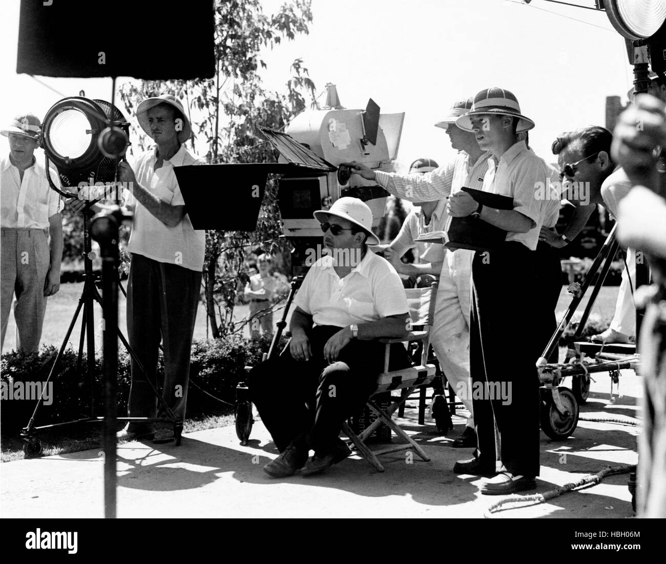 THE ADVENTURES OF TOM SAWYER, director Norman Taurog (seated) on set ...