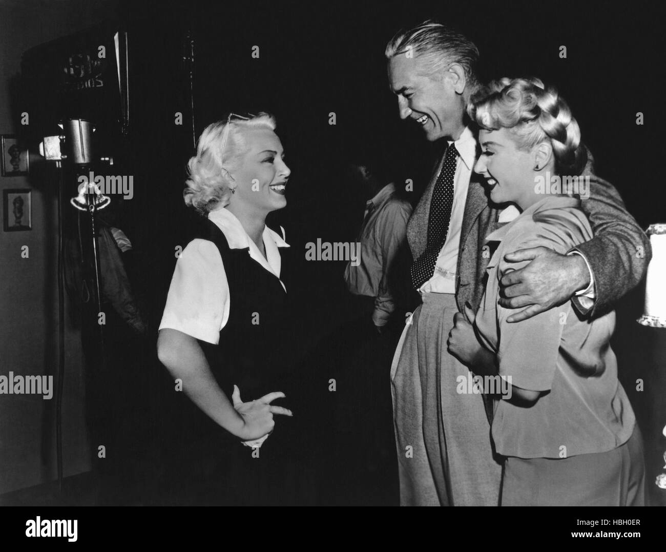 ADVENTURE, Lana Turner, (left) visits director Victor Fleming, Joan Blondell, on-set, 1945 Stock ...