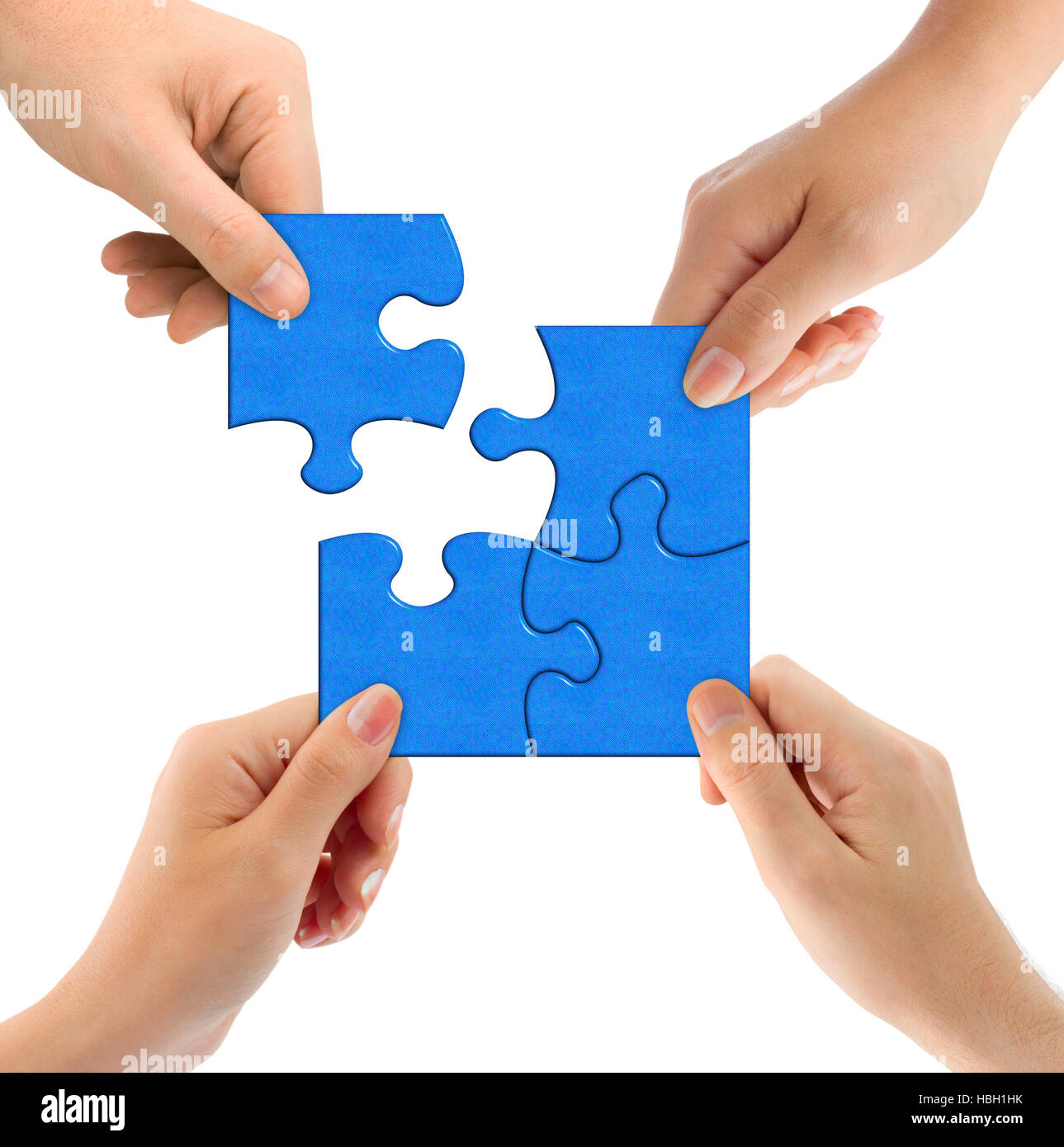 Four hands puzzle hi-res stock photography and images - Alamy