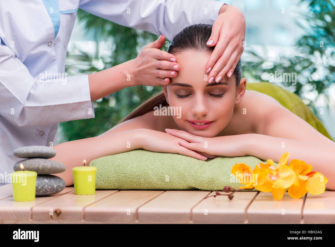 Young woman during massage session Stock Photo - Alamy