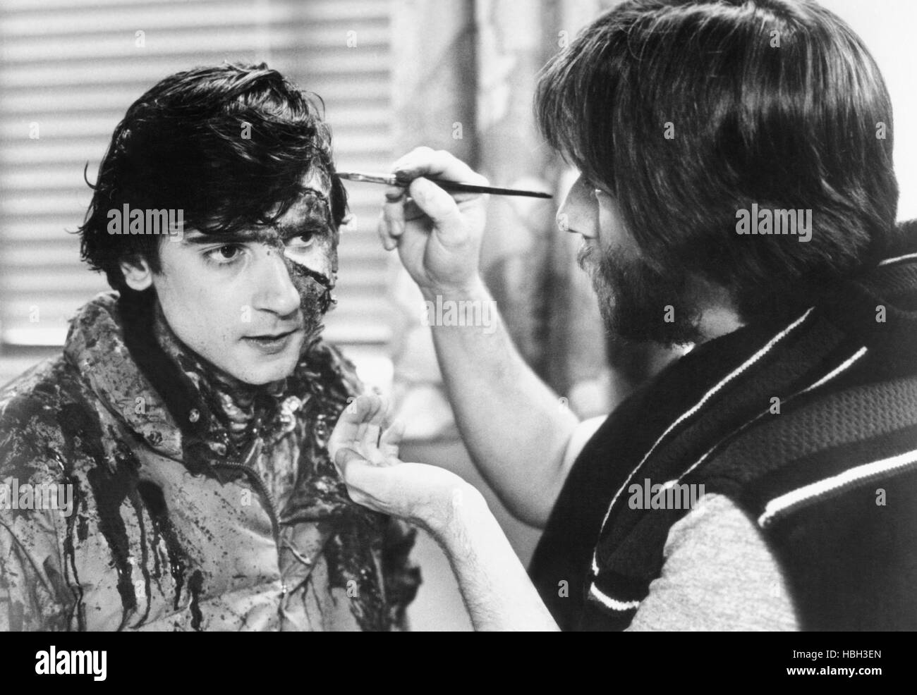 AN AMERICAN WEREWOLF IN LONDON, Rick Baker, right, applies makeup to ...
