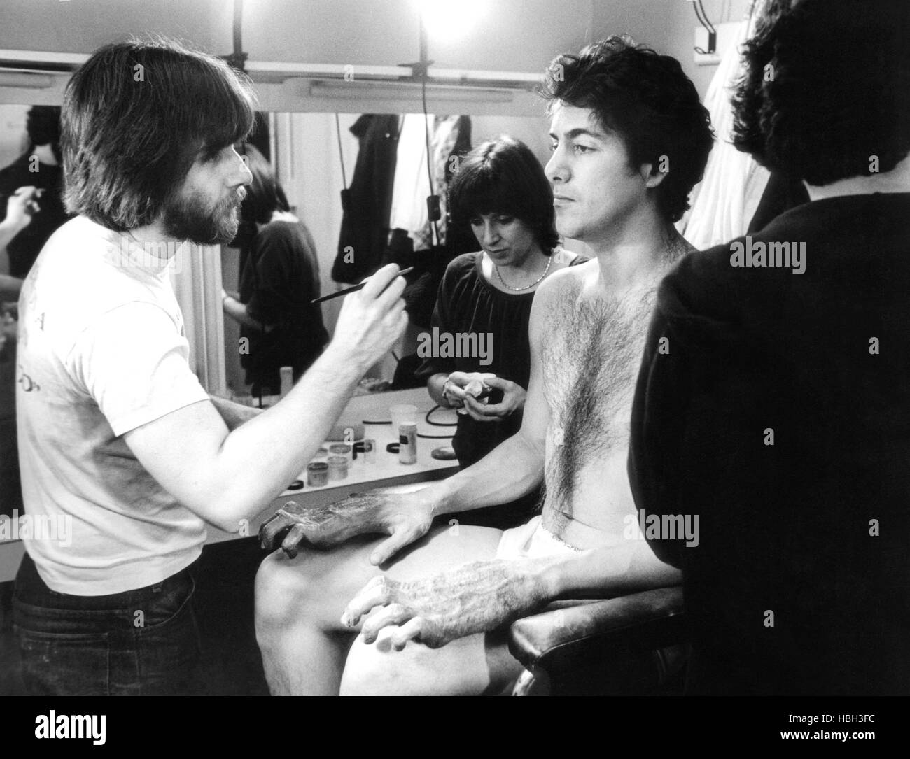 AN AMERICAN WEREWOLF IN LONDON, Rick Baker, left, applies makeup to ...