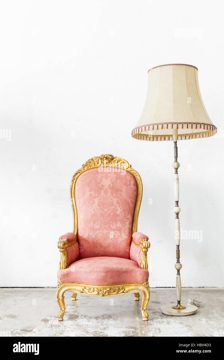 Pink Vintage Chair with lamp Stock Photo - Alamy