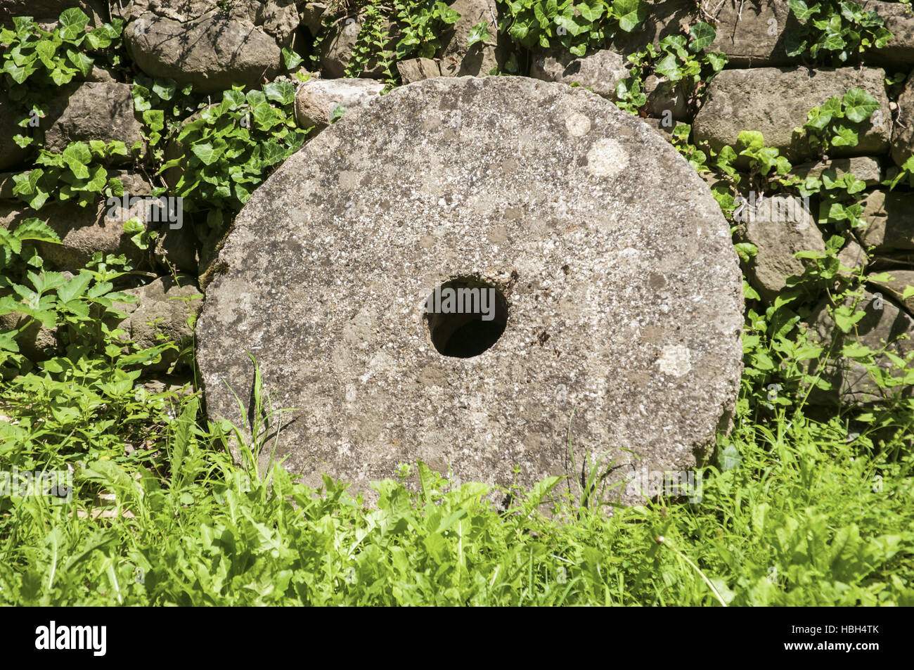 Old millstone closeup Stock Photo - Alamy
