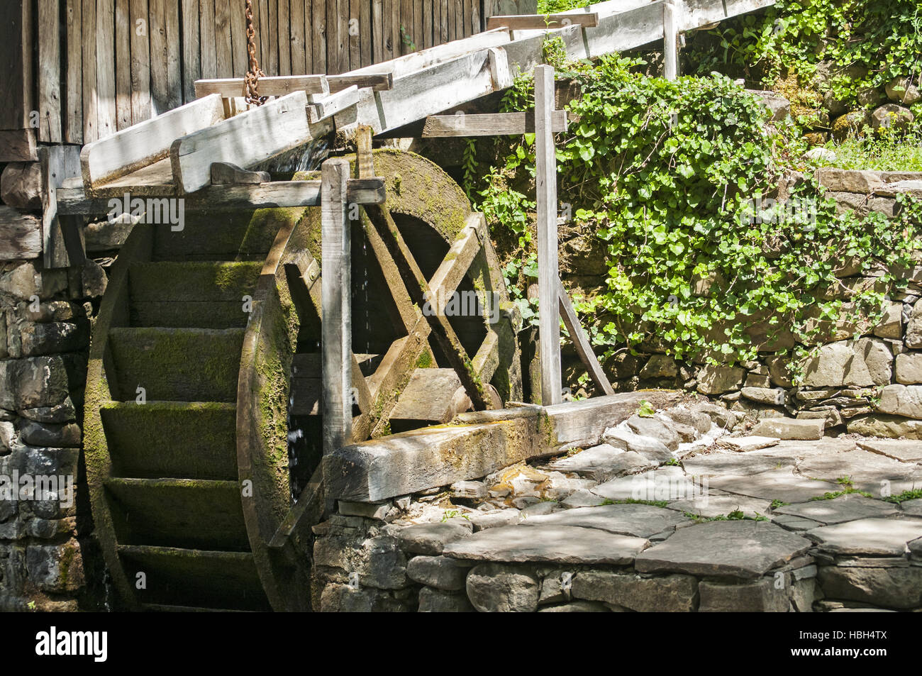 Wooden mill wheel Stock Photo - Alamy