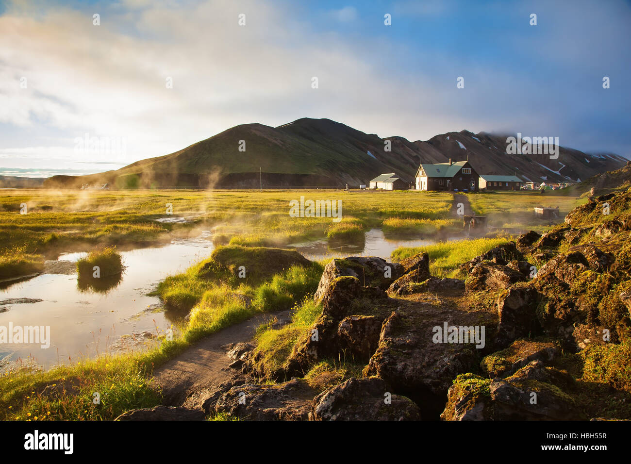 The source of thermal water steam rises Stock Photo - Alamy