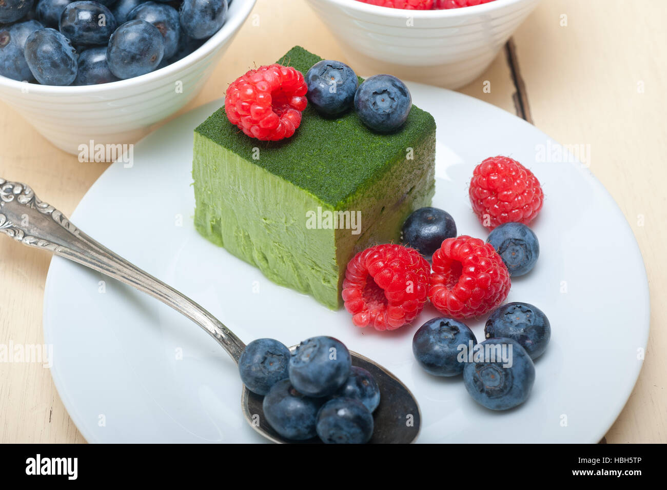 green tea matcha mousse cake with berries Stock Photo - Alamy