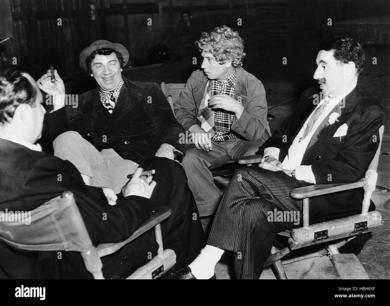 AT THE CIRCUS, from left, Chico Marx, Harpo Marx, Groucho Marx, on-set ...