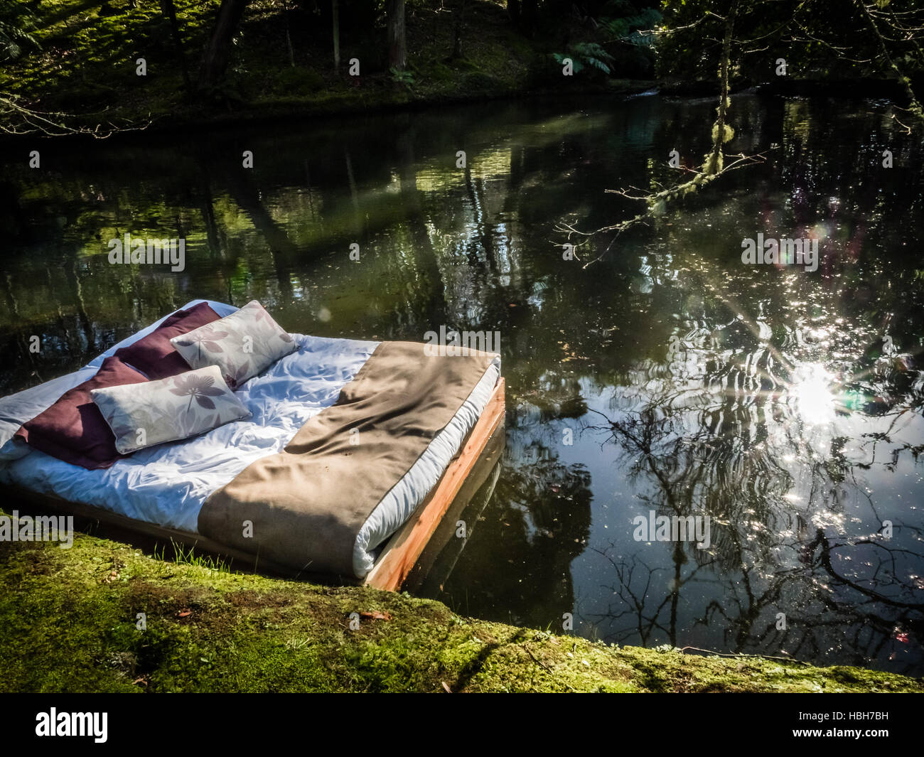Bed on a lake Stock Photo - Alamy
