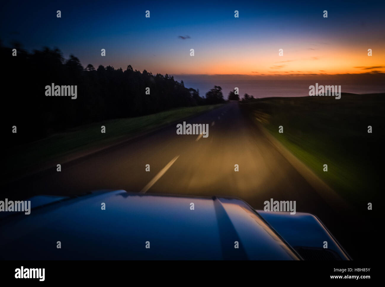 Driving at dusk Stock Photo - Alamy