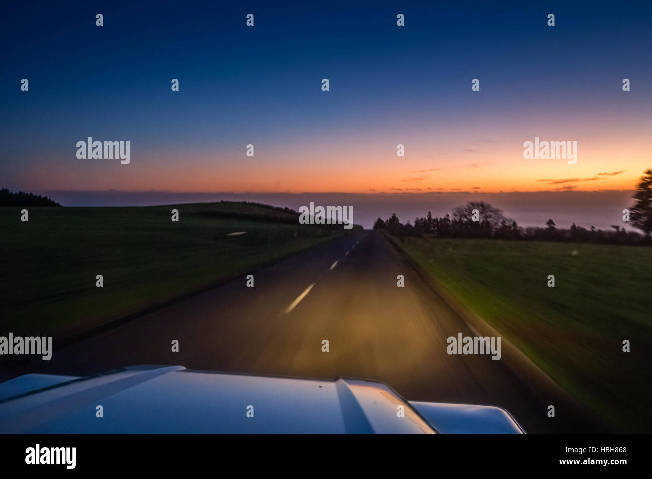 Driving at dusk Stock Photo - Alamy