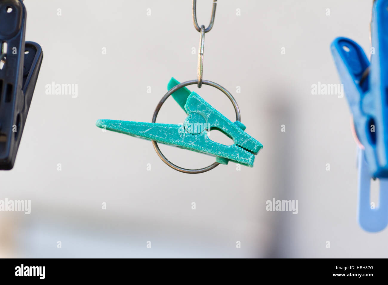 Worn out and broken plastic clothespin Stock Photo - Alamy