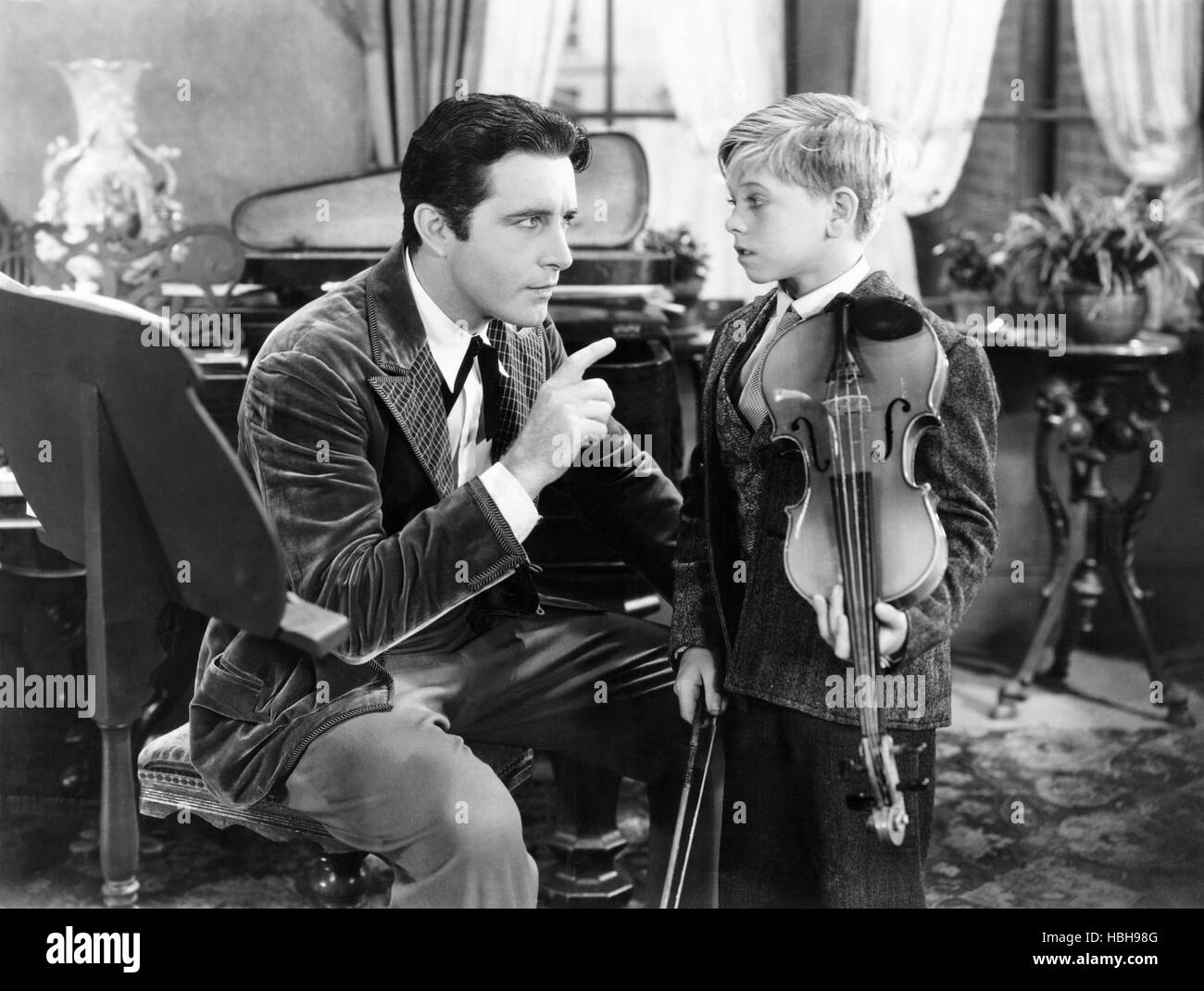 BELOVED, from left: John Boles, Mickey Rooney, 1934 Stock Photo - Alamy