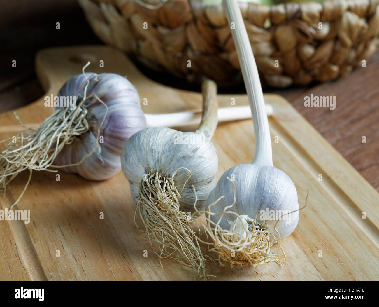 head of garlic on the table rustic Stock Photo - Alamy