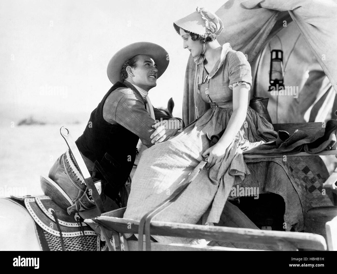 THE BIG STAMPEDE, from left, John Wayne, Mae Madison, 1932 Stock Photo ...