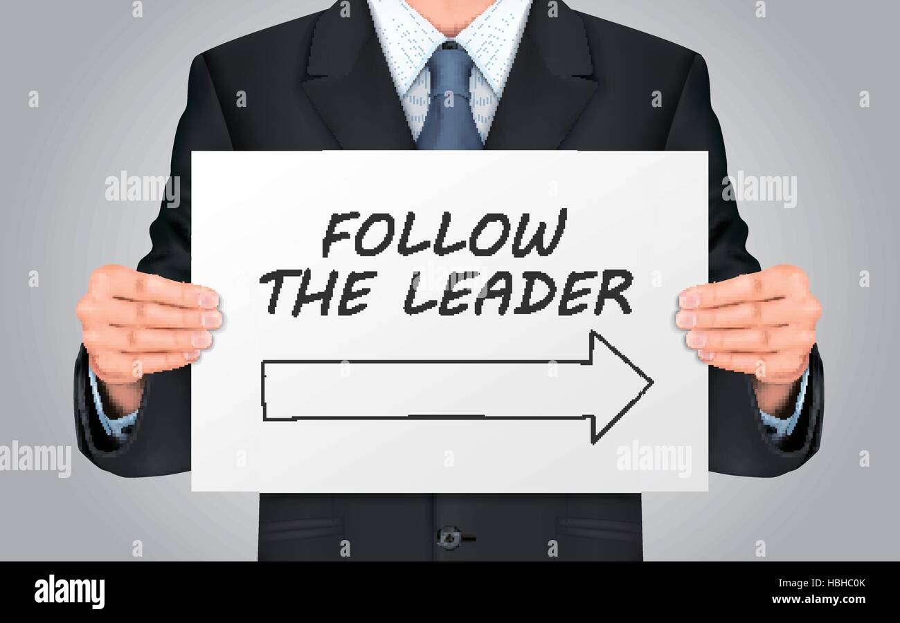 close-up look at businessman holding follow the leader poster Stock ...