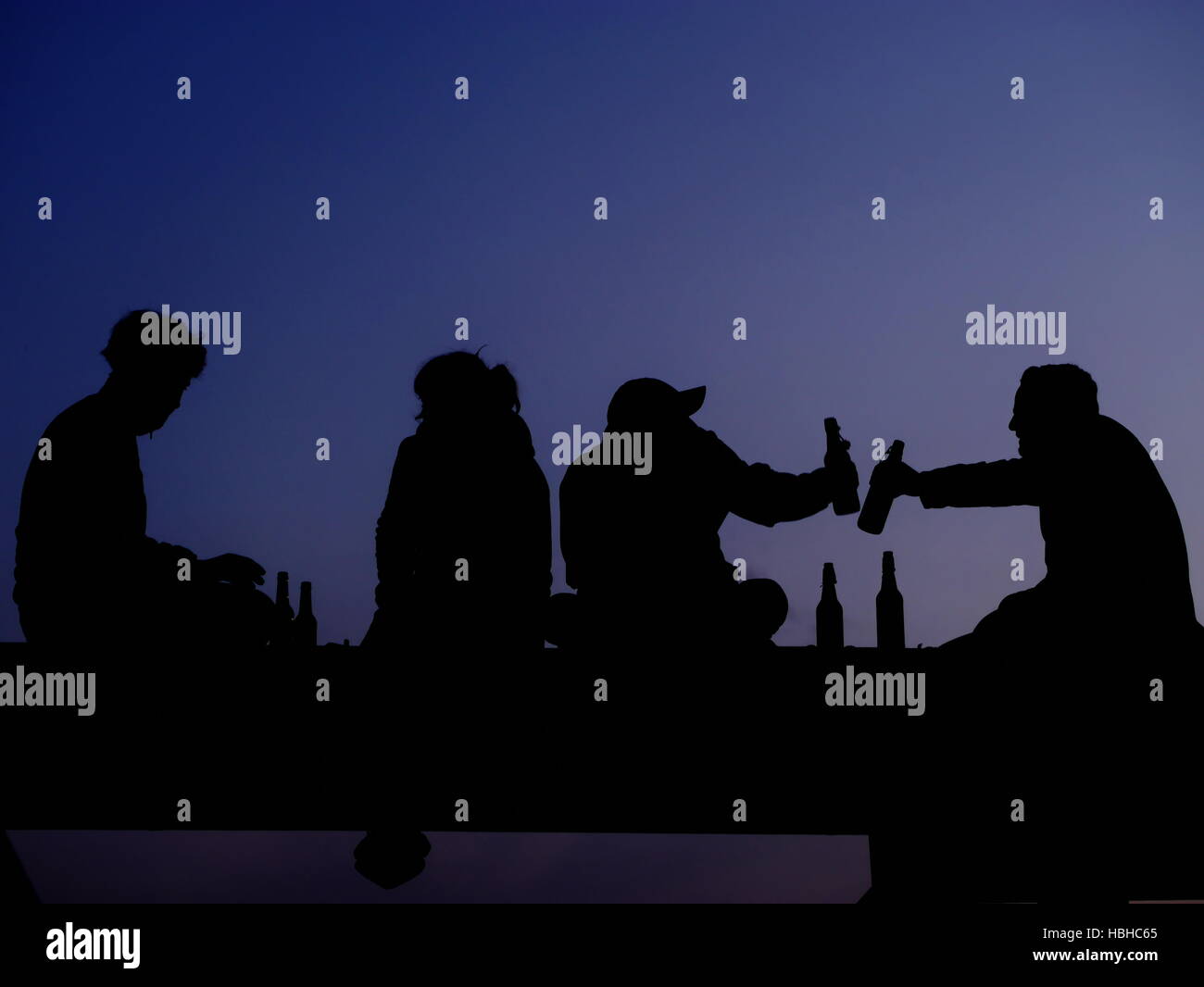 Silhouette of four friend Stock Photo - Alamy