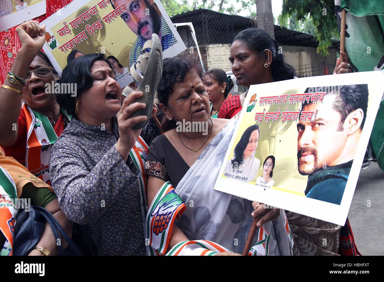 Women hitting Salman Khan poster with slipper, Thane, Bombay, Mumbai ...