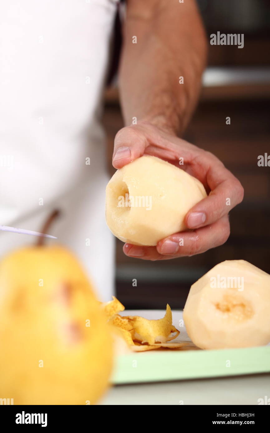 Peeling pear. Making Pear Tarte Tatin with Cardamom series Stock Photo ...