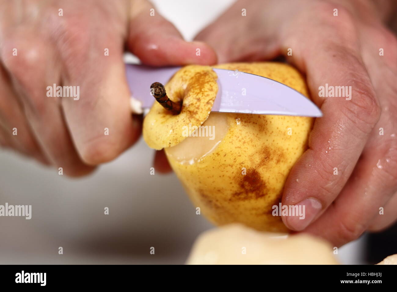 Peeling pear. Making Pear Tarte Tatin with Cardamom series Stock Photo ...