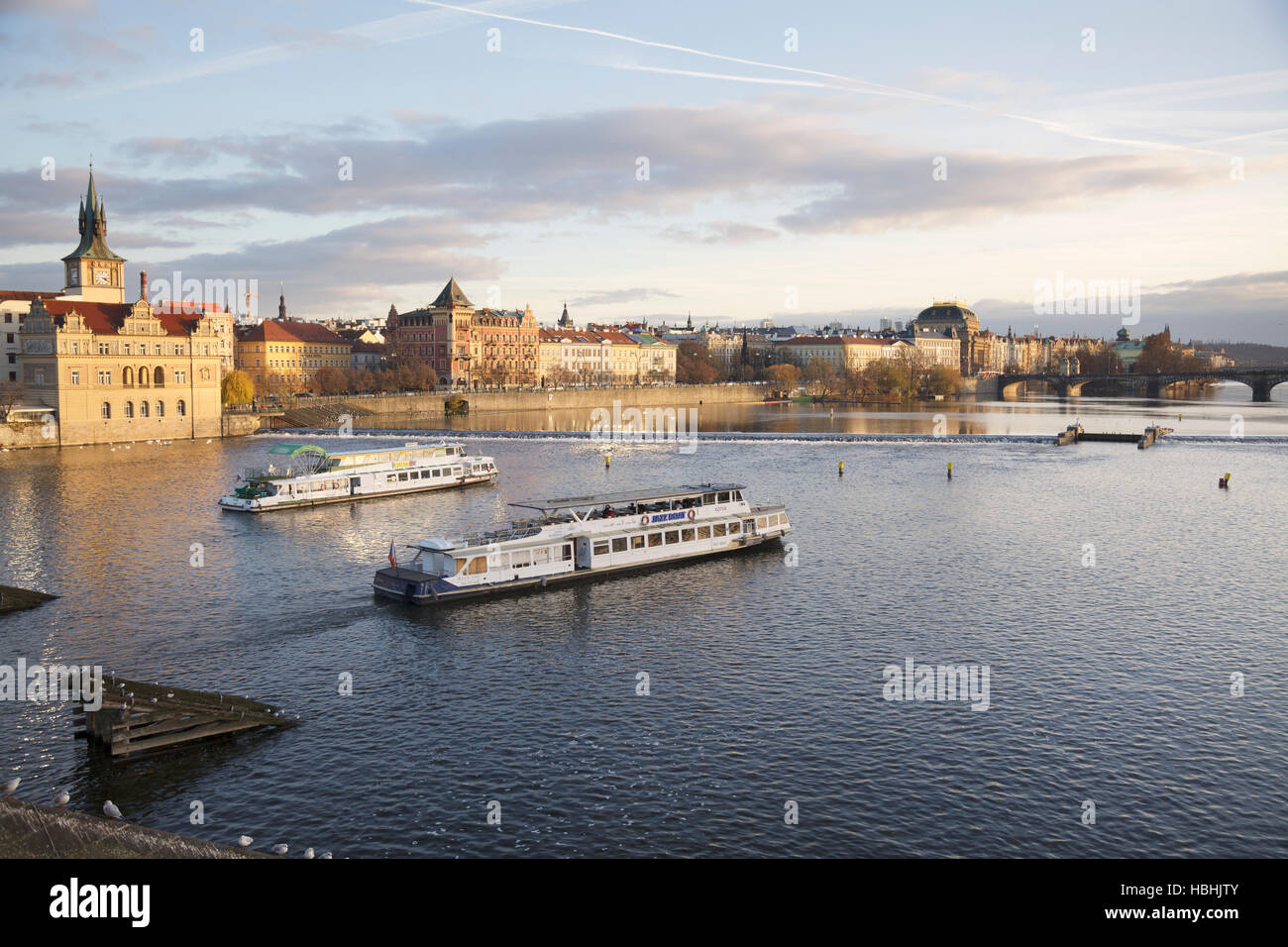view of the Vlatva River from the Charles Bridge with tourist boats, Prague, Czech Republic ...